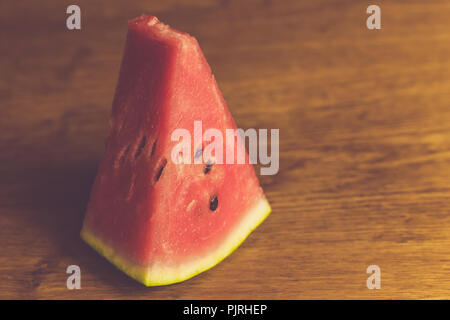big piece of watermelon on wooden background. rustic style Stock Photo ...