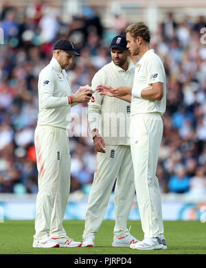 England's Joe Root (left) and James Anderson in discussion during day ...