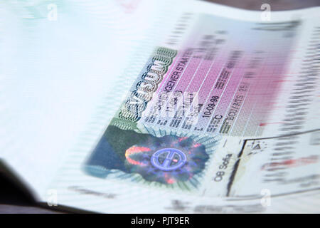 Schengen visa stamp in international passport. Shengen document for ...