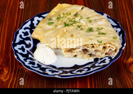 Traditional uzbek Hanum wiht meat Stock Photo - Alamy