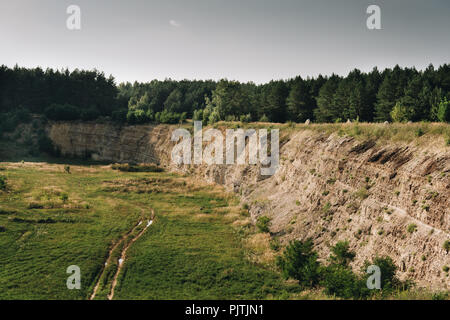Rock Outcrop and Quarry Landscape with Green Farmland and Hills in ...