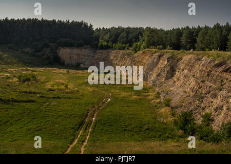 Rock Outcrop and Quarry Landscape with Green Farmland and Hills in ...