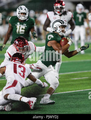 Colorado State running back Izzy Matthews (24) is stopped by Florida ...