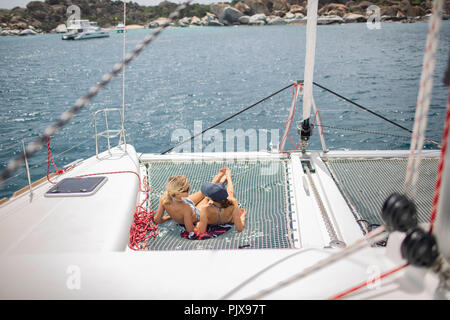 Young woman relaxing on sailing boat, British Virgin Islands Stock ...