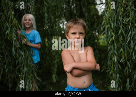 Children playing under willow tree Stock Photo - Alamy