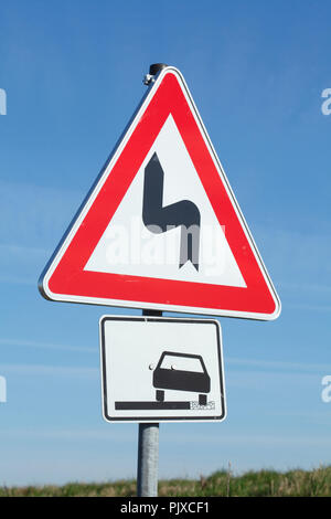 Double bend first to right road sign in Britain Stock Photo - Alamy