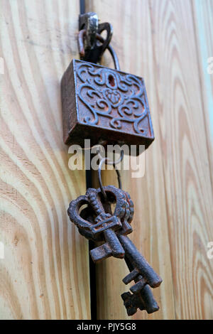 A photo of a vintage iron on a dark rustic background with copyspace ...