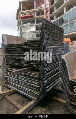 Building materials are stacked on the construction site for a new Stock ...