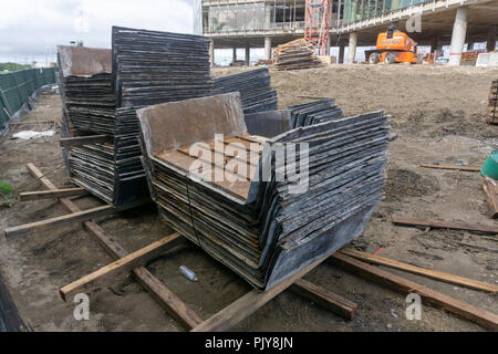 Building materials are stacked on the construction site for a new Stock ...