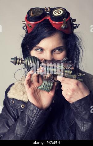 headshot dieselpunk girl with ray gun Stock Photo - Alamy