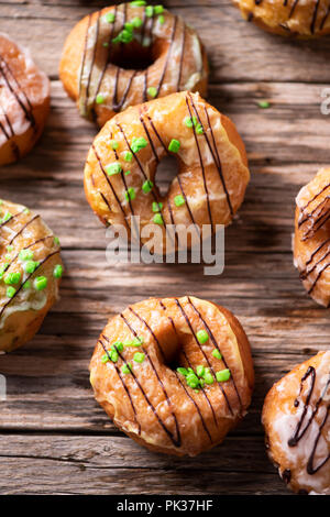 Fresh doughnuts on wooden table. Close up Stock Photo - Alamy