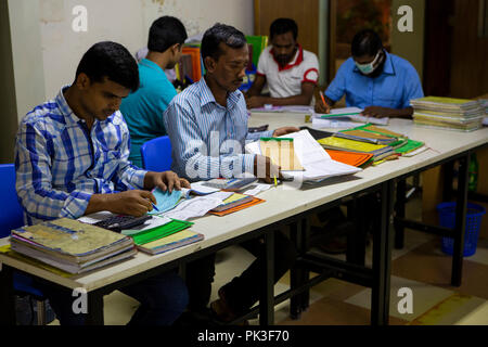 Stock check, accounting and processing orders inside a garment factory ...