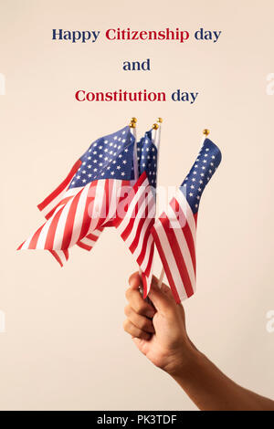 American flag and constitution text against caucasian girl kissing her ...