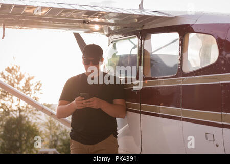 Pilot using mobile phone Stock Photo: 122631594 - Alamy