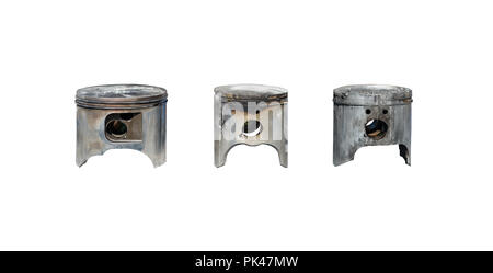 Burned, damaged car pistons. Isolated on a white background with a ...