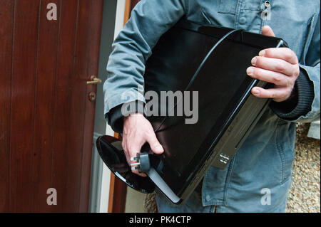 Breaking and entering home or house, thief attempting to breach ...