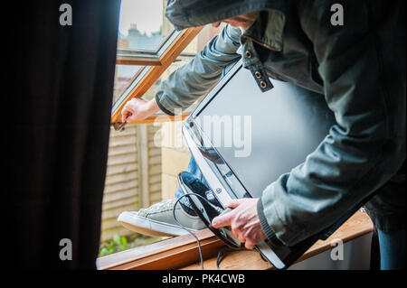 Breaking and entering home or house, thief attempting to breach Stock ...