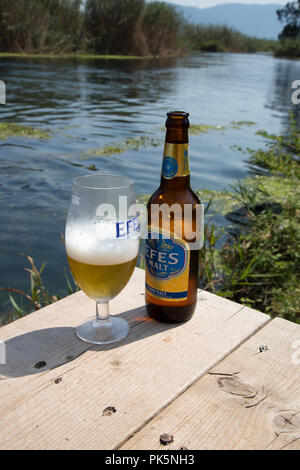 Cold bottle of Efes malt Pilsen beer taken on the beach promenade ...