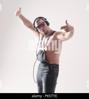 rapper in jeans overalls dancing breakdance .isolated on white ...
