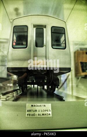 Miniature of railway station with moving train. Toy locomotive with ...