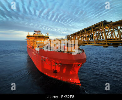 Australia. Industry. Bass Strait. Offshore oil platform at sunrise ...