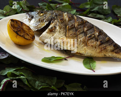 fried dorado stuffed with aromatic herbs Stock Photo - Alamy