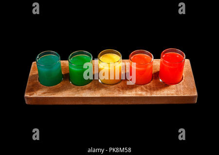 Multicolored opaque cocktails, a set of shots in one row, five servings ...