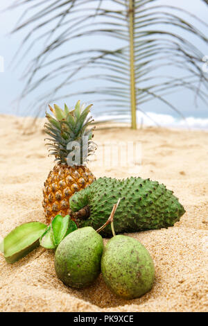 exotic fruit sausep on the sand near the ocean Stock Photo - Alamy