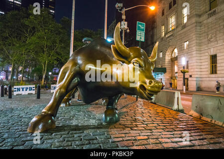 Sculpture of Charging Bull downtown Broadway covered with snow during ...