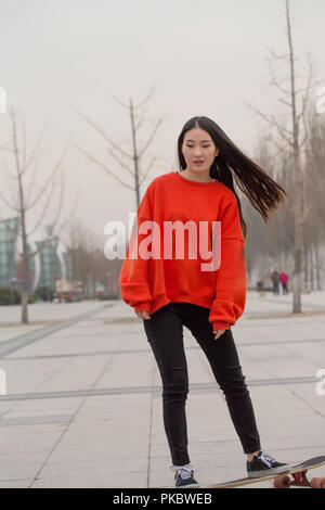 Portrait of attractive cheerful girl riding car practicing simulation ...