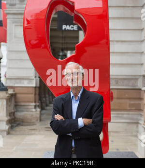 Architect Richard Rogers stands in front of a wooden model of his ...