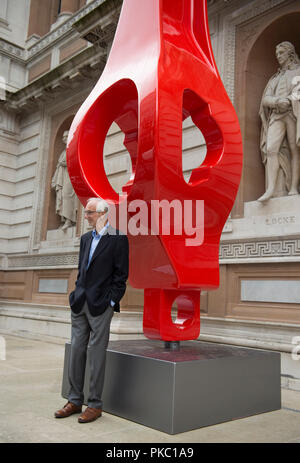 Architect Richard Rogers stands in front of a wooden model of his ...
