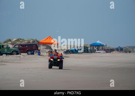 Lifeguard drives a ATV on the beach in Carova 4x4 section of beach in ...