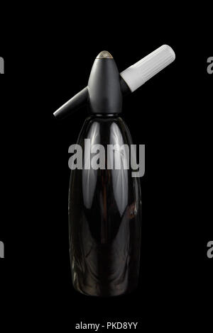 Black shiny metal table siphon for soda, next to a transparent bucket ...