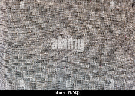 Jute cotton rough woven gray mat texture on a wooden textured rustic ...