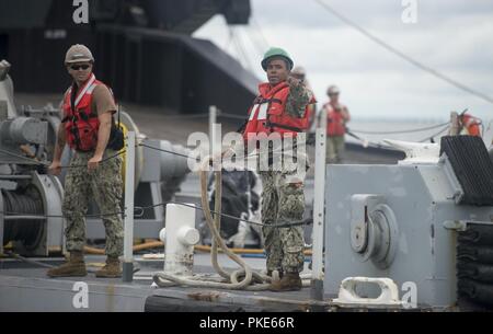 An Improved Navy Lighterage System (INLS) causeway ferry approaches the ...