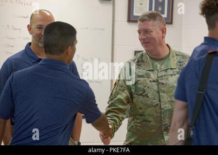 U.S. Soldiers shakes hands with Brig. Gen. David Wilson, the 40th Chief ...