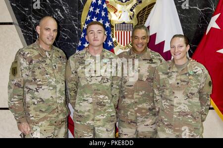 U.S. Army Sgt. Maj. Curt Donaldson (left) listens as Capt. Omar ...