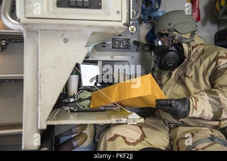A Soldier wearing Mission Oriented Protective Posture (MOPP) gear test ...