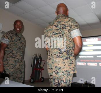 U.S. Marine Corps Sgt. Alphonso M. Lee Jr., reads Cpl. Darnell A ...