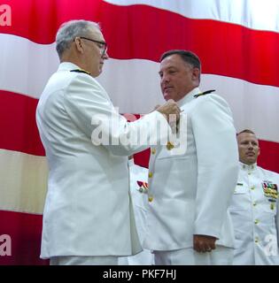 Rear Adm. Brad Collins, Commander, Navy Region Northwest, speaks at a ...