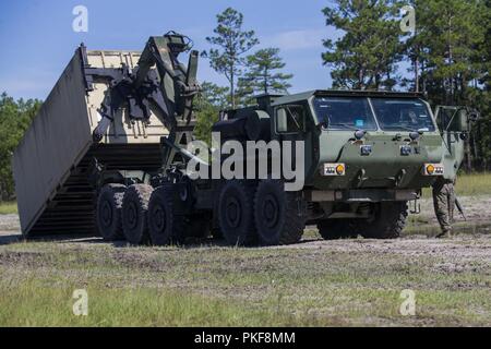 A U.S. Marine Corps logistical vehicle system replacement (LVSR) of 1st ...