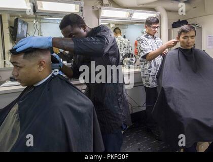 Sailors in an American Navy Barber Shop on the USS Brooklyn Stock Photo ...