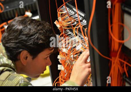 An Airman assigned to the 609th Air Operations Center works on the ...