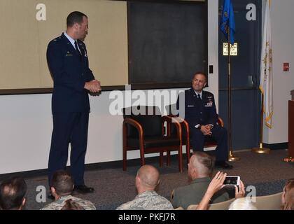 Col. Adam G. Wiggins, left, the commander of the 143d Operations Group ...