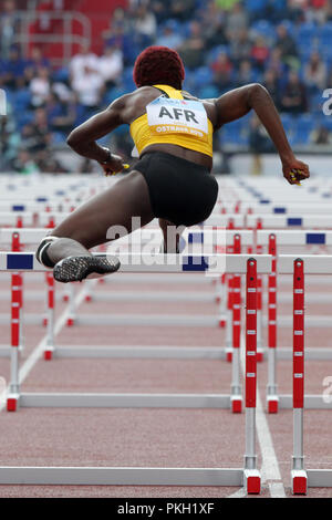 Tobi Amusan, of Nigeria, competes in the women 100 meters hurdles ...