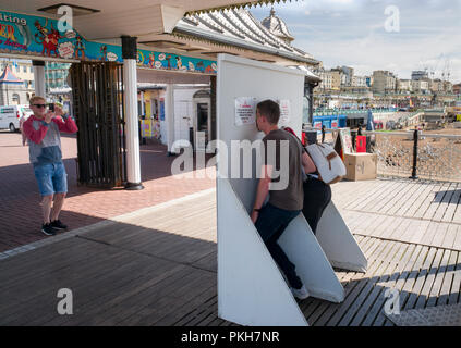 The clock tower on the entrance of Brighton Palace Pier. (Photo by Dave ...