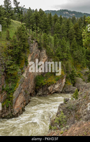 Rushing water carves a path through the limestone of Johnston Canyon in ...