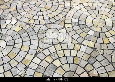Circle pattern of new cobble stones ground Stock Photo - Alamy