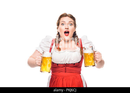 shocked waitress in traditional bavarian dress with mugs of light beer ...